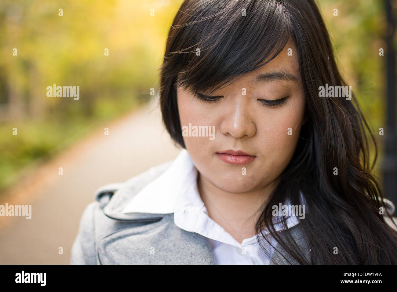 Portrait of girl looking sad Stock Photo - Alamy