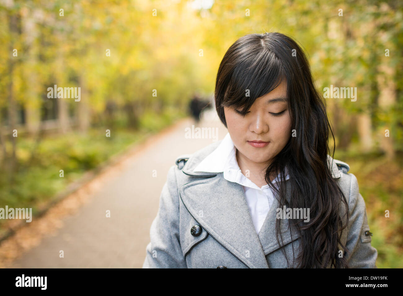 Portrait of girl looking sad Stock Photo - Alamy