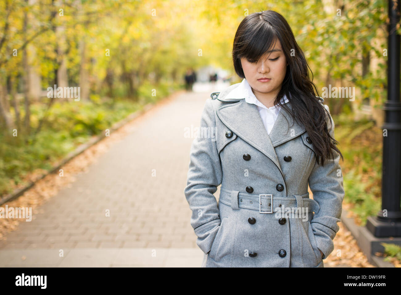 Portrait of girl looking sad Stock Photo - Alamy