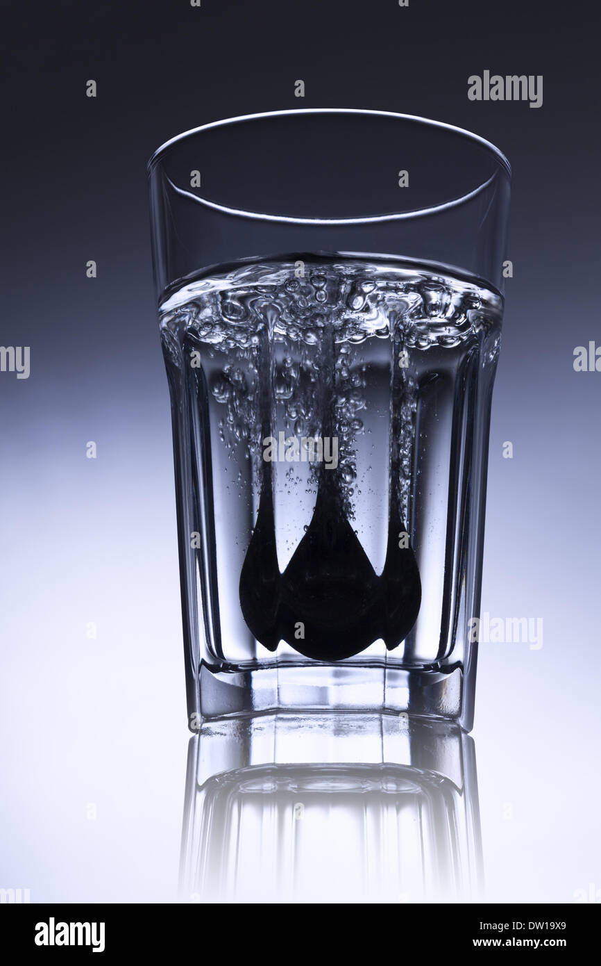 simple water-glass with spoon and bubbles Stock Photo - Alamy