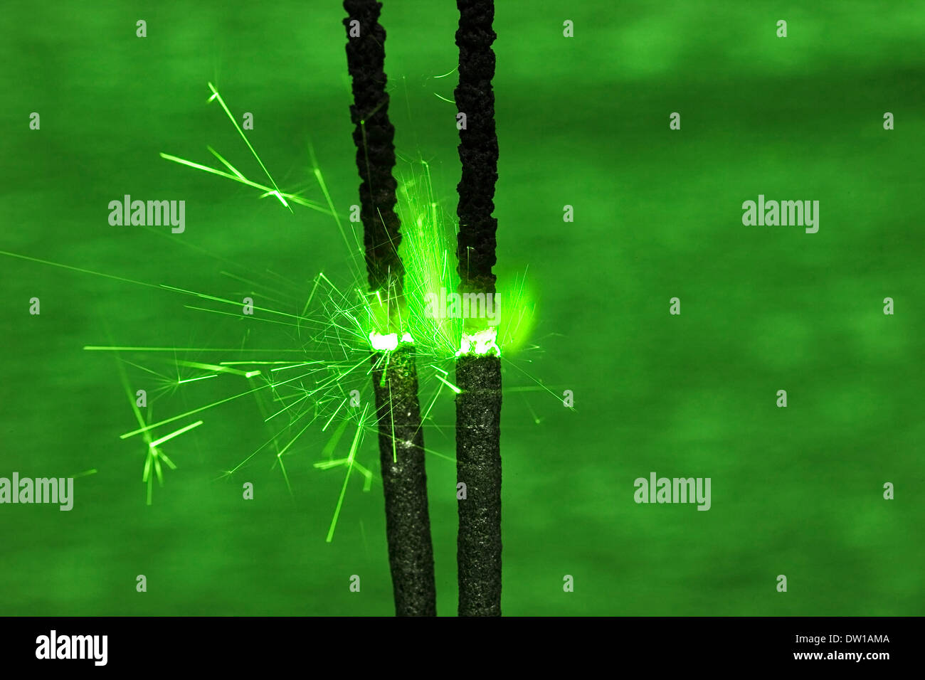 bengal fire on green background Stock Photo - Alamy