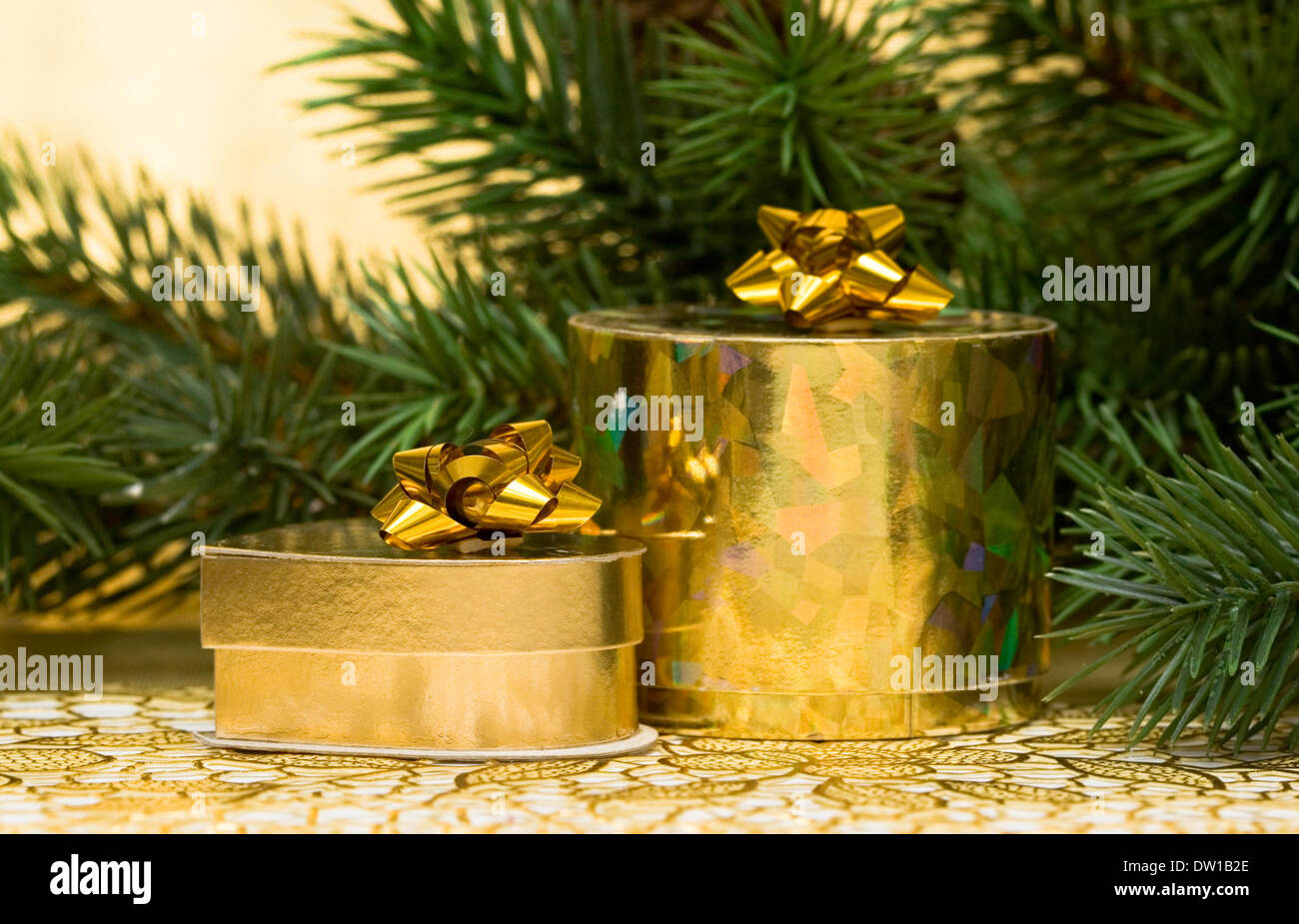 gold gift boxes with Christmas tree Stock Photo - Alamy