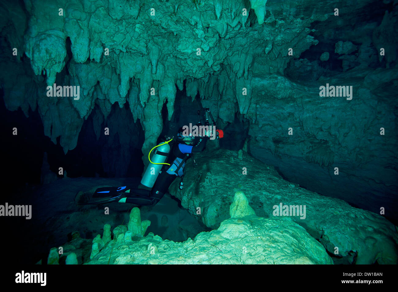 Scuba diver swimming thru the underwater Grand Cenote cave, Yucatan ...