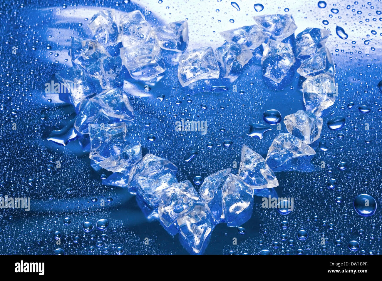 heart from ice on blue background Stock Photo - Alamy