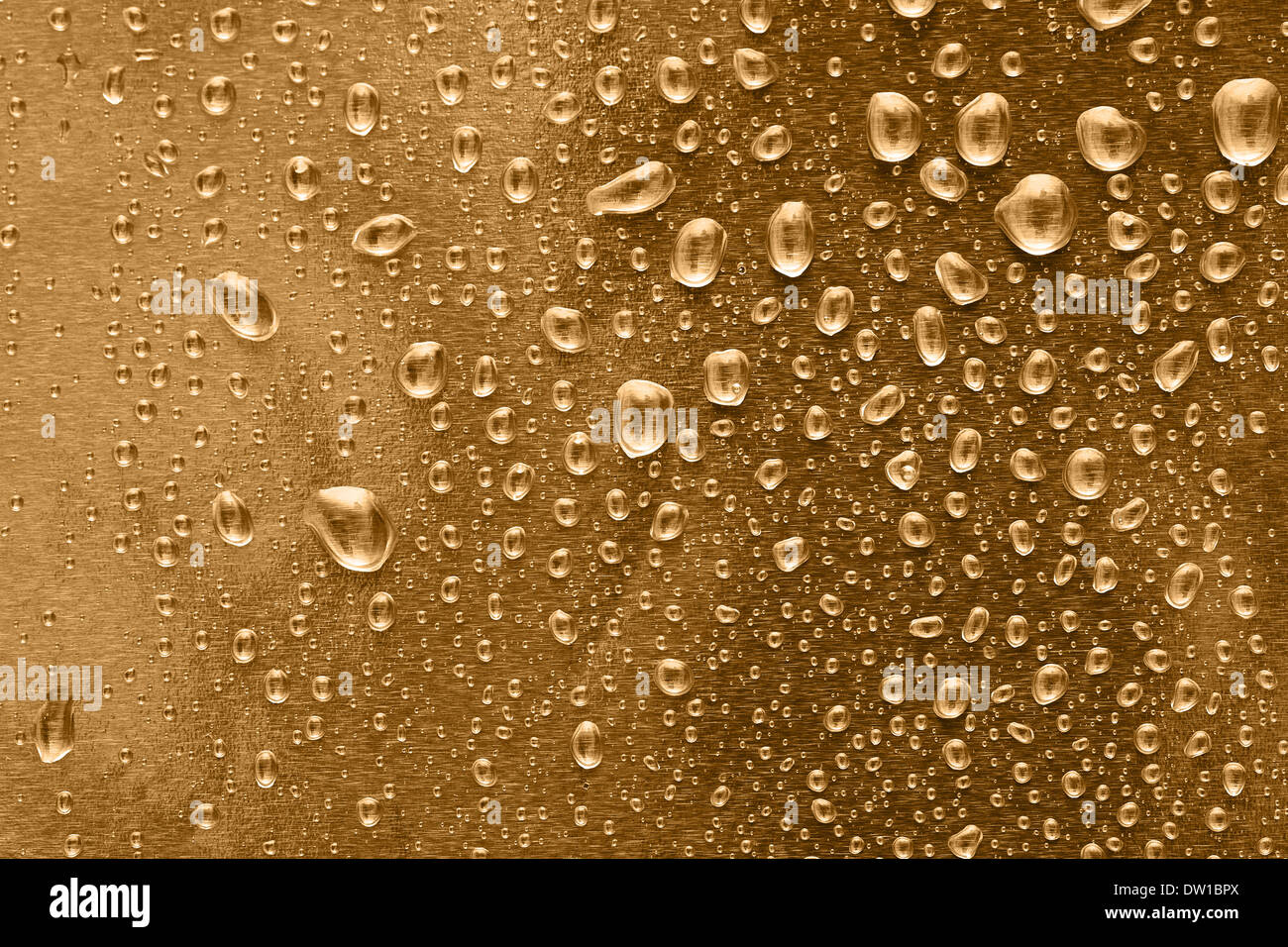 golden water drops for background Stock Photo - Alamy