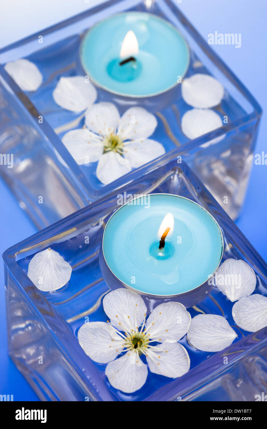 Candle with spring flowers in water Stock Photo - Alamy