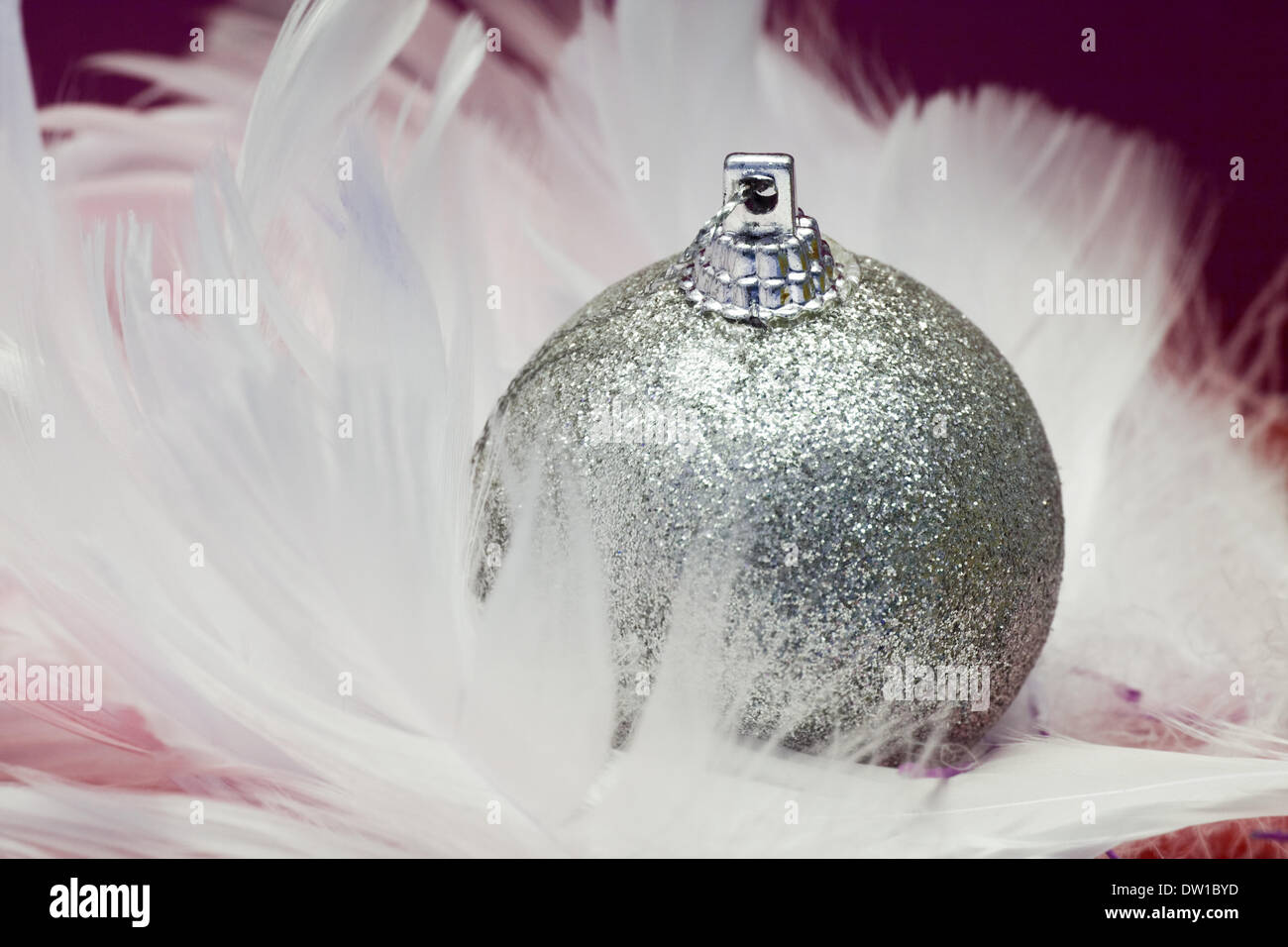 Christmas ball on white feather Stock Photo - Alamy