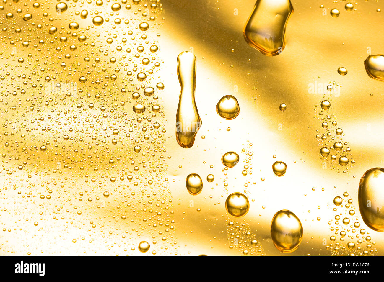 golden water drops for background Stock Photo - Alamy