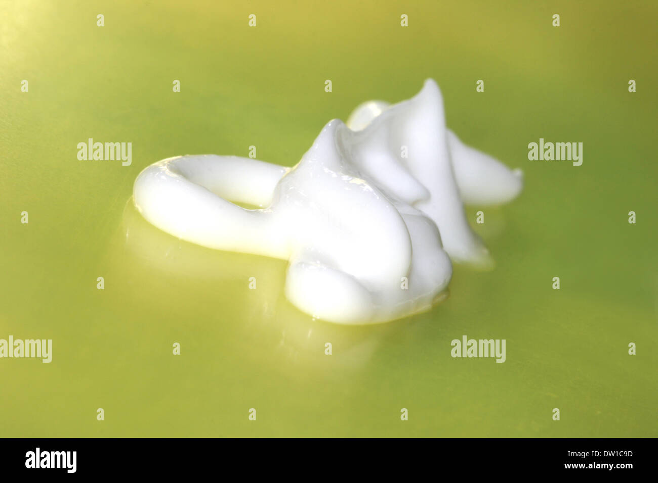 shampoo or cream on yellow background Stock Photo - Alamy