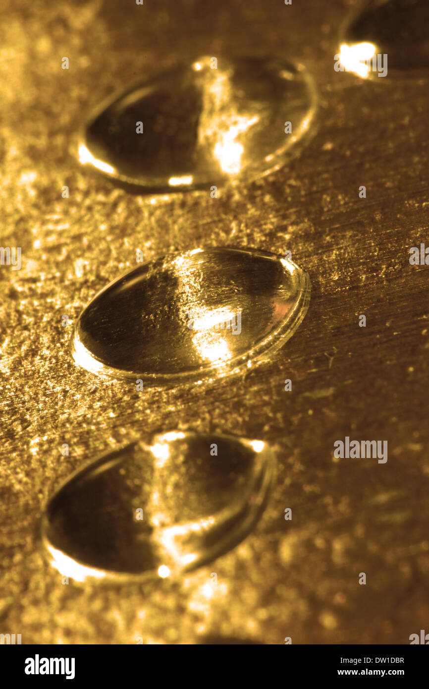golden water drop for background Stock Photo - Alamy