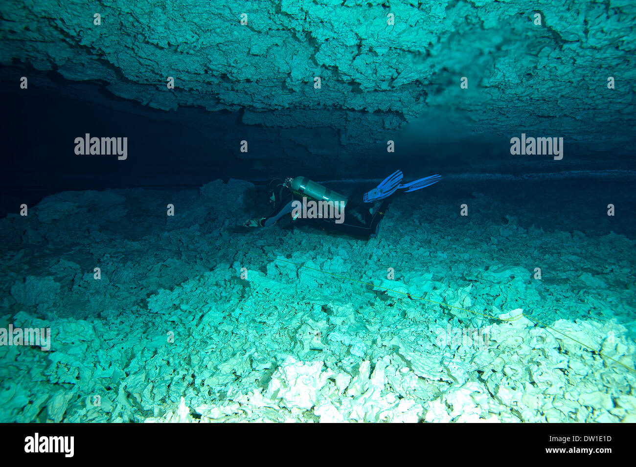 Scuba diver swimming thru the underwater Kulukan Cenote cave, Yucatan ...