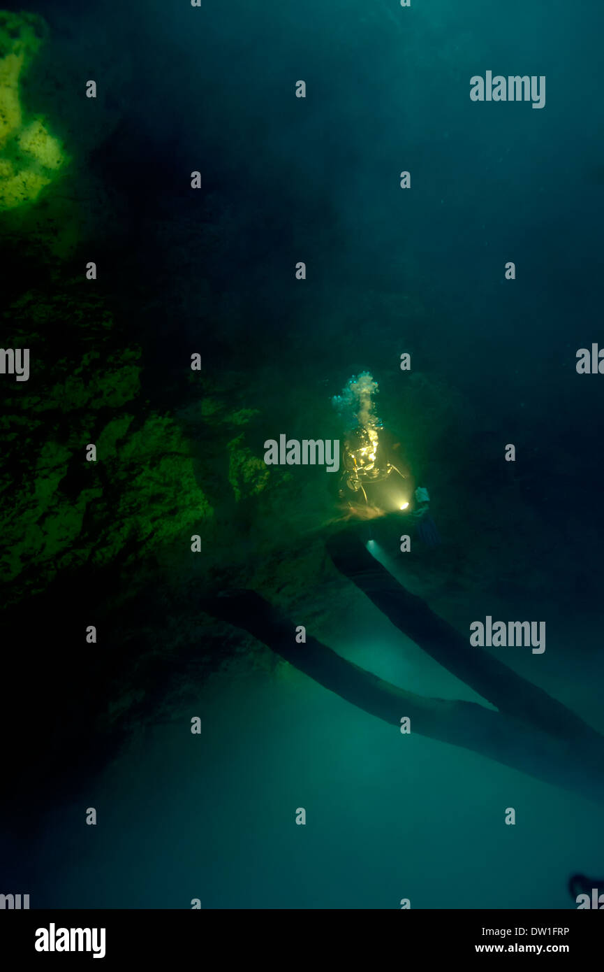Scuba diver swimming thru the underwater cenote Pit cave, Yucatan ...