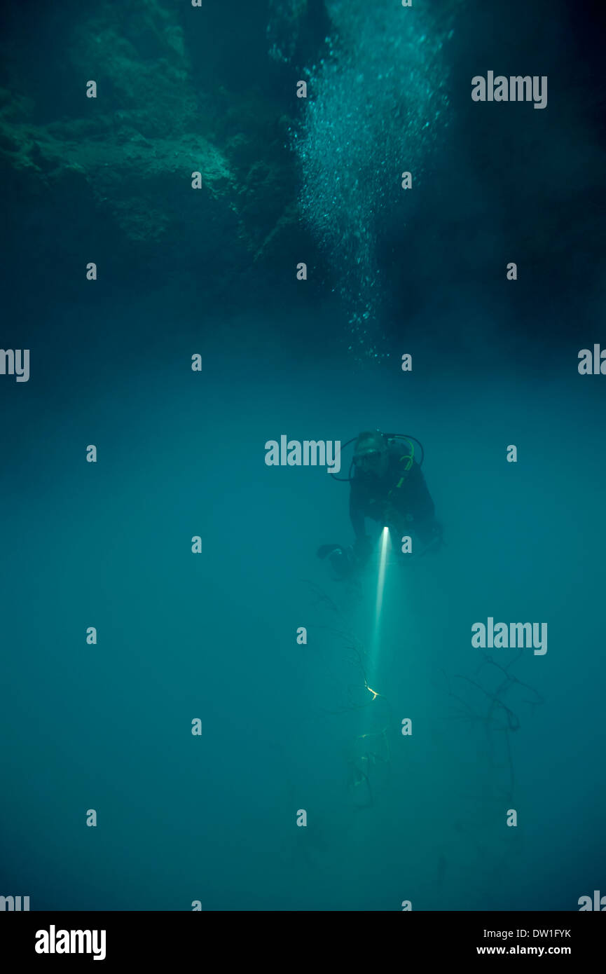 Scuba diver swimming thru the underwater cenote Pit cave, Yucatan ...