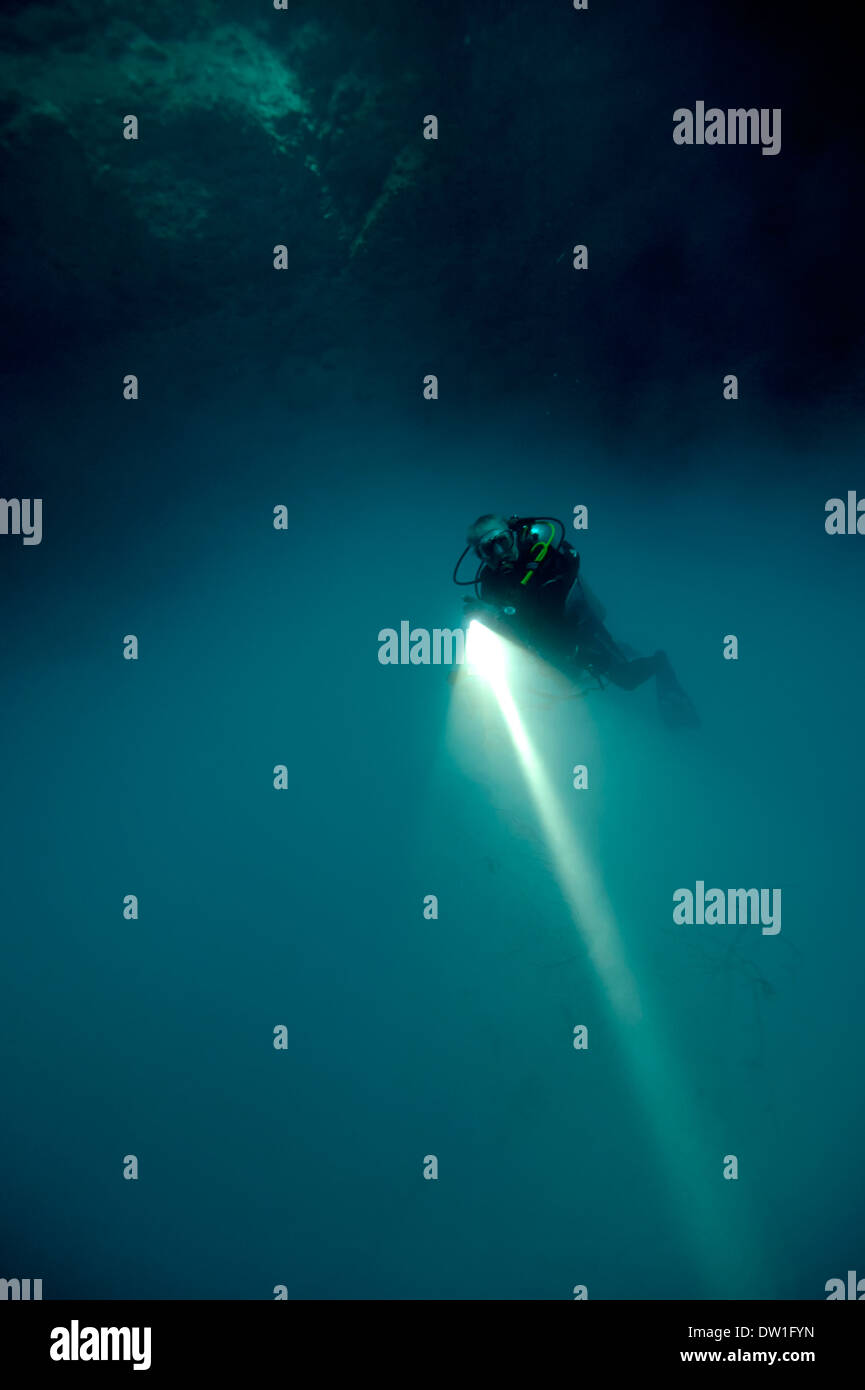 Scuba diver swimming thru the underwater cenote Pit cave, Yucatan ...