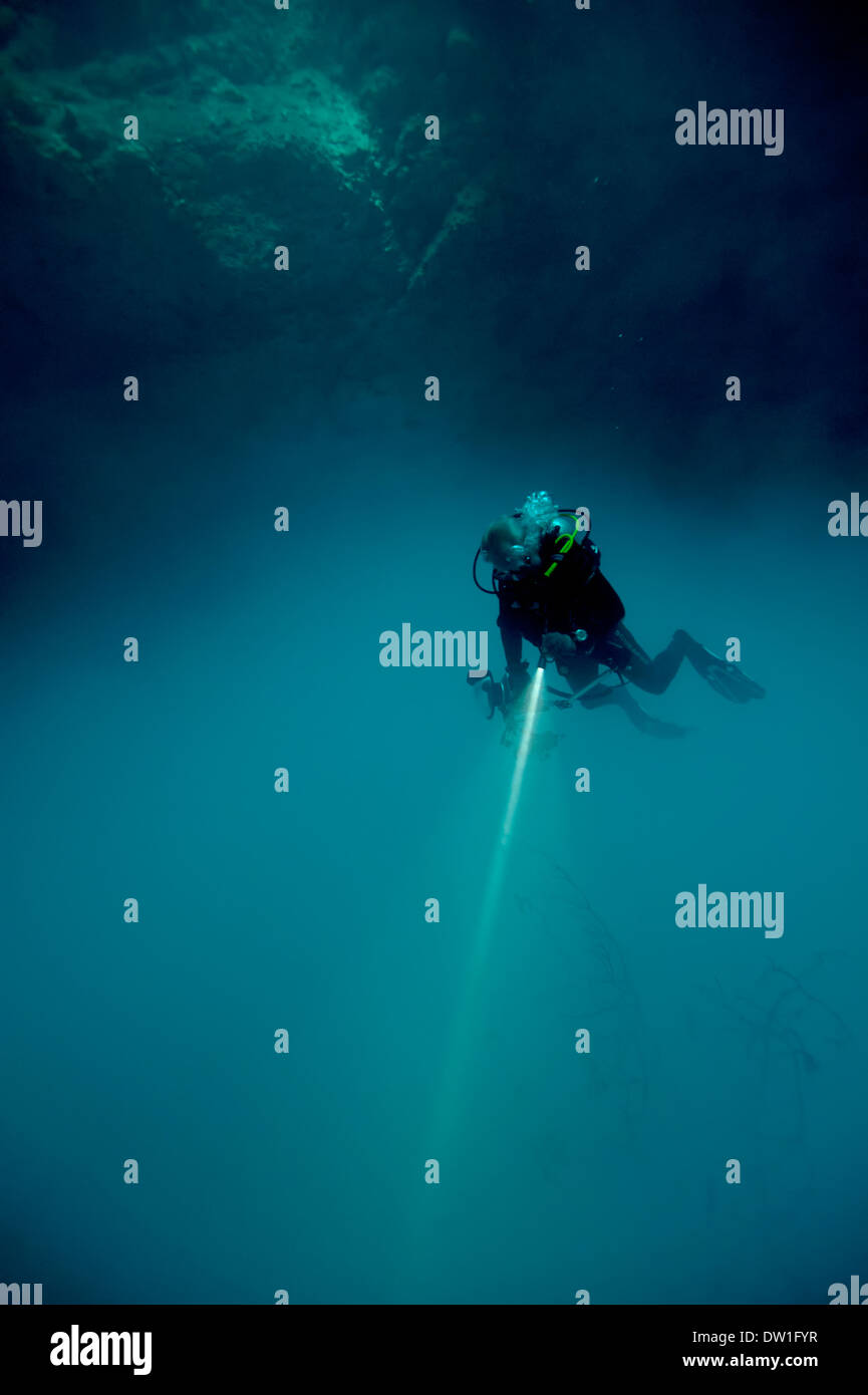 Scuba diver swimming thru the underwater cenote Pit cave, Yucatan ...