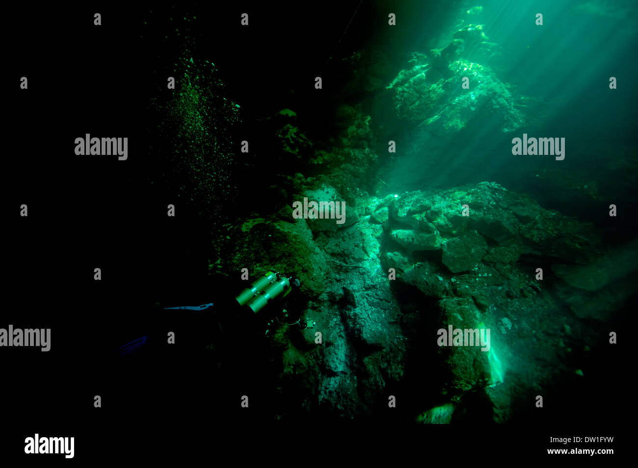 Scuba diver swimming thru the underwater cenote Pit cave, Yucatan ...