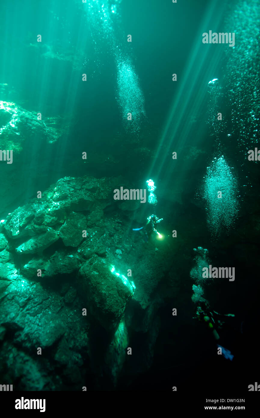 Scuba diver swimming thru the underwater cenote Pit cave, Yucatan ...