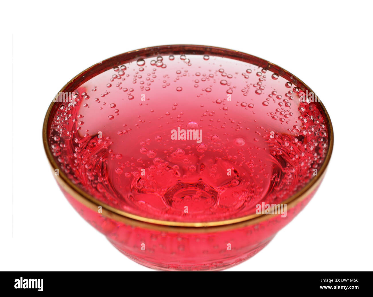glass with red aerated water Stock Photo - Alamy