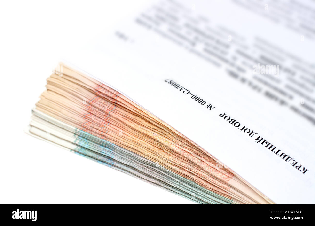 credit contract on stack of money Stock Photo - Alamy