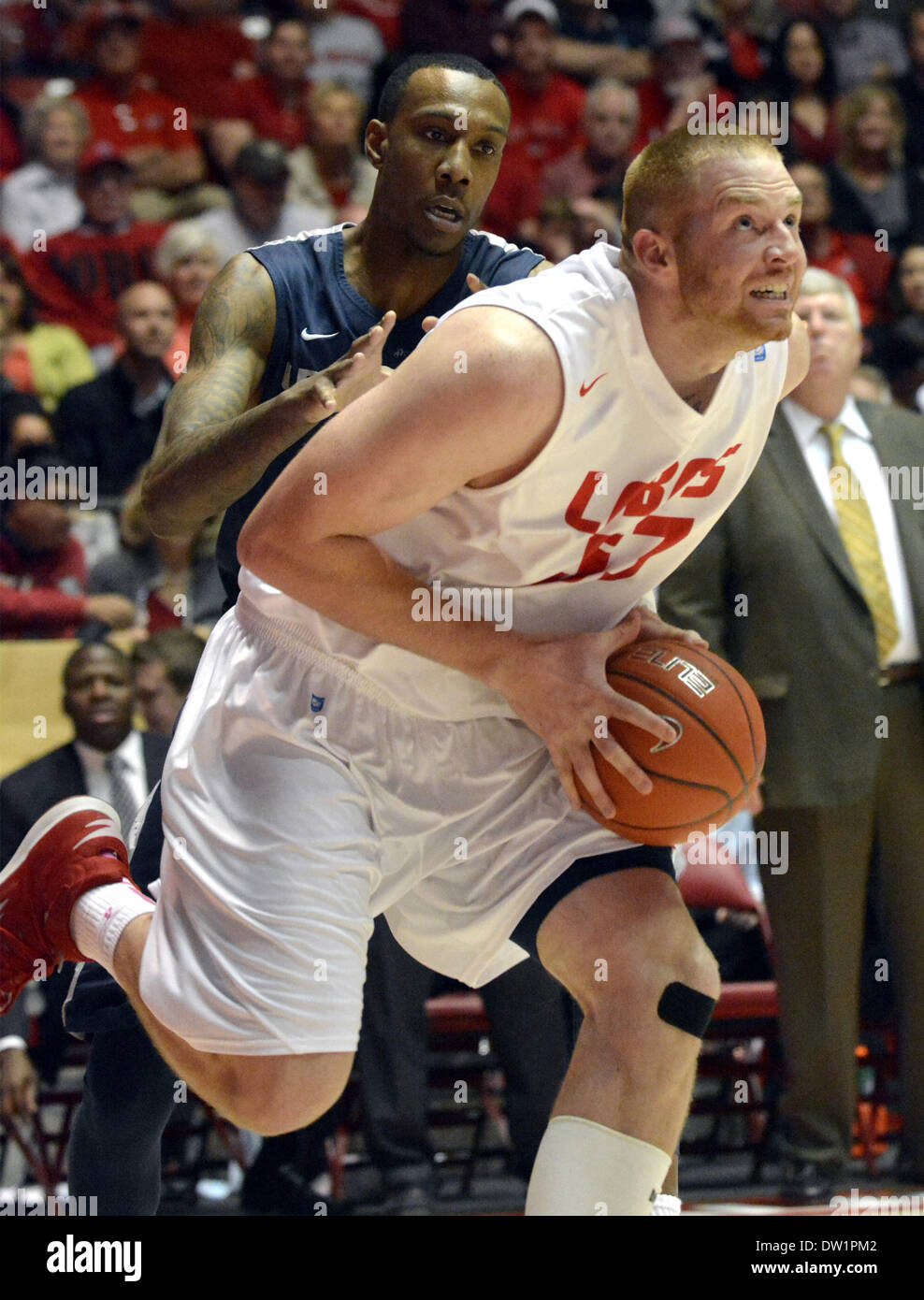 Feb. 25, 2014 - U.S. - SPORTS --UNM's Alex Kirk drive in from of Utah ...
