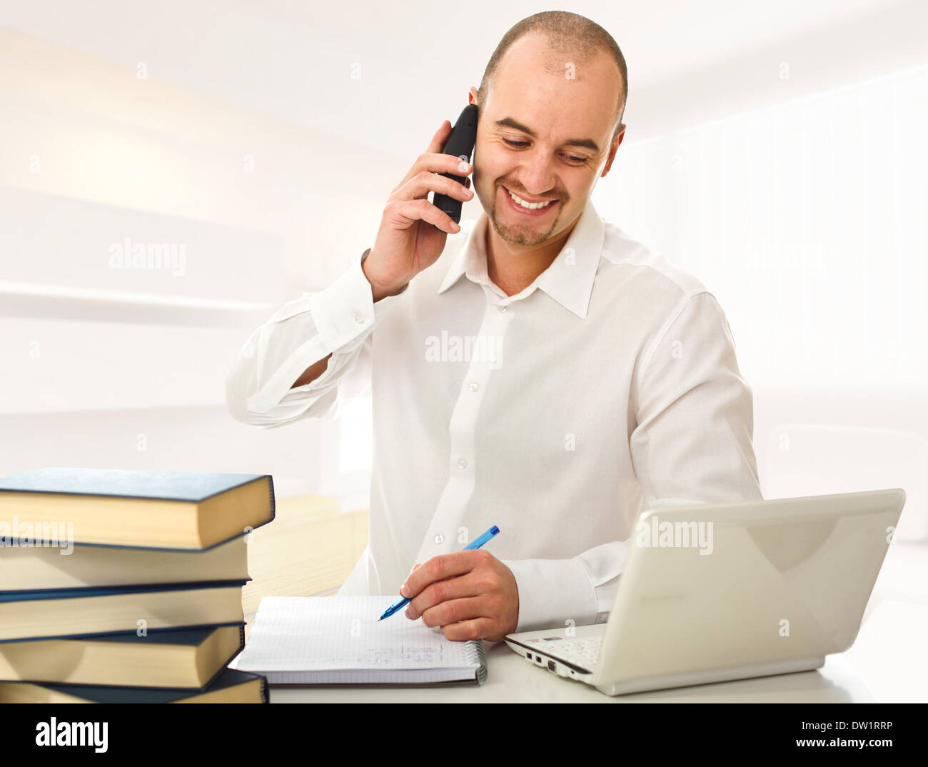 smiling man at work Stock Photo - Alamy