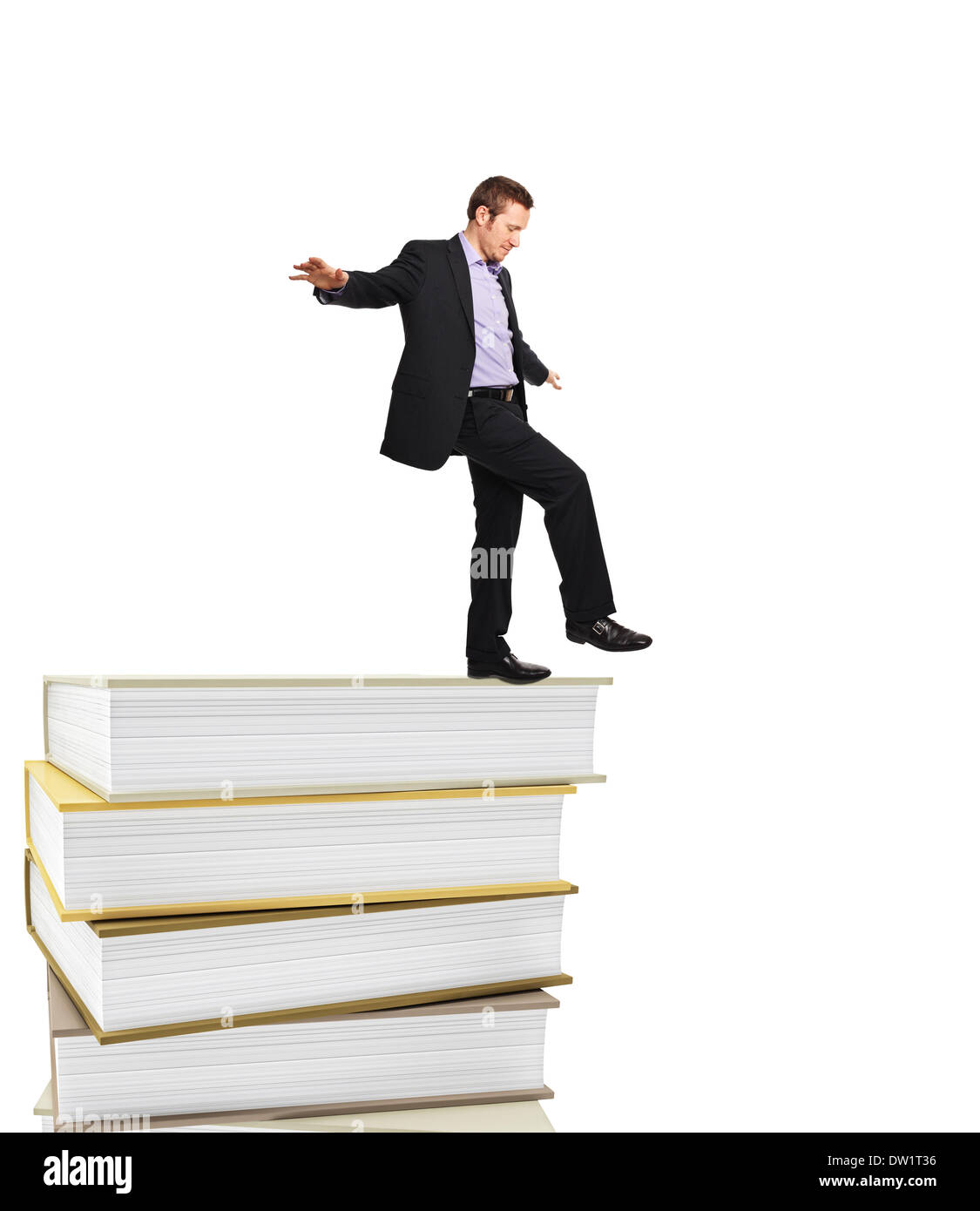 Standing man on book pile hi-res stock photography and images - Alamy