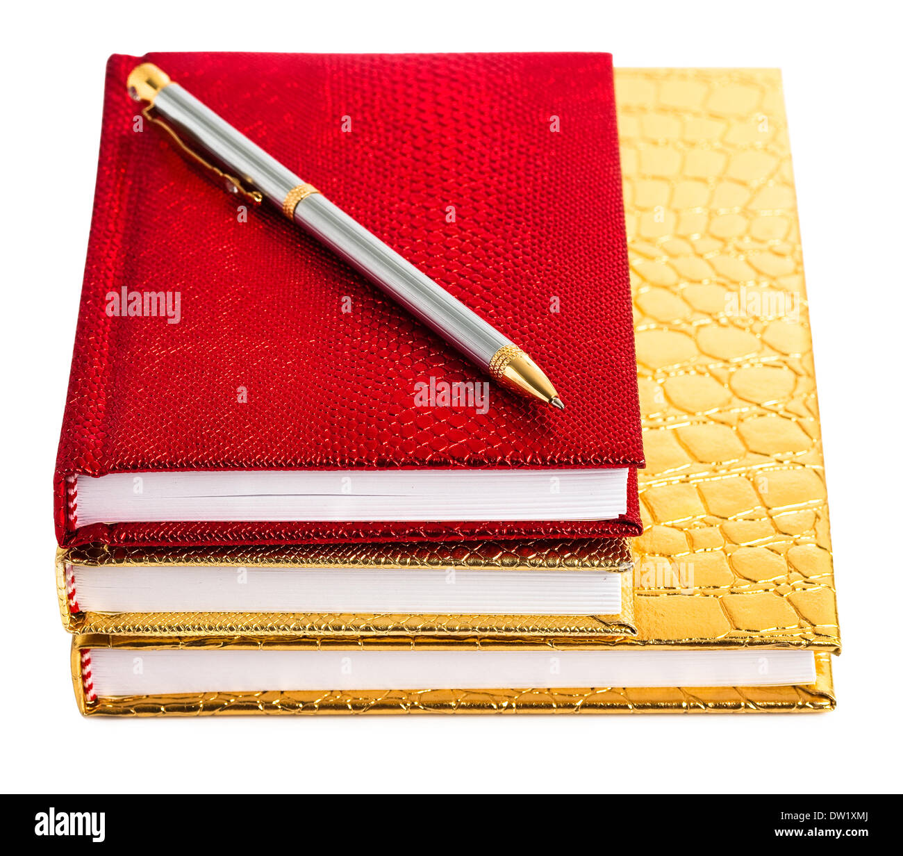 Golden and red notebooks with silver pen Stock Photo - Alamy