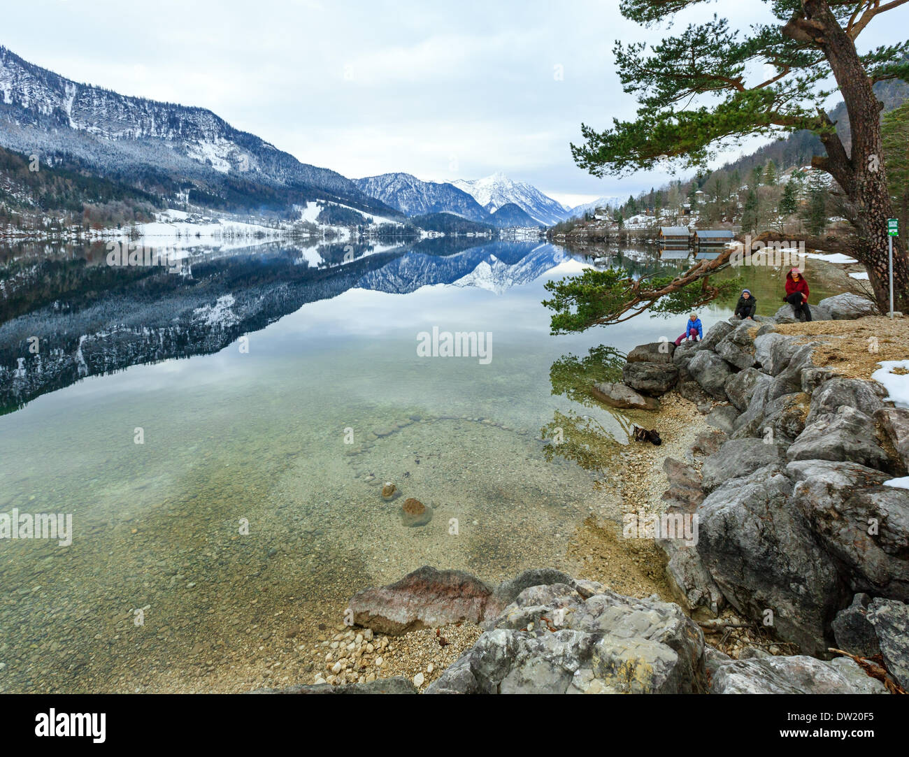 Alpine winter lake view and family Stock Photo - Alamy