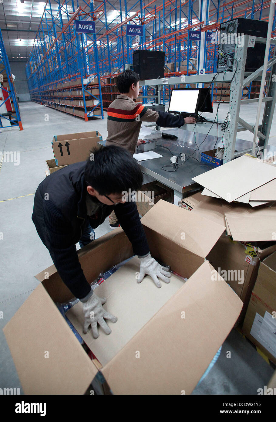 Langfang, China's Hebei Province. 25th Feb, 2014. A worker puts goods ...