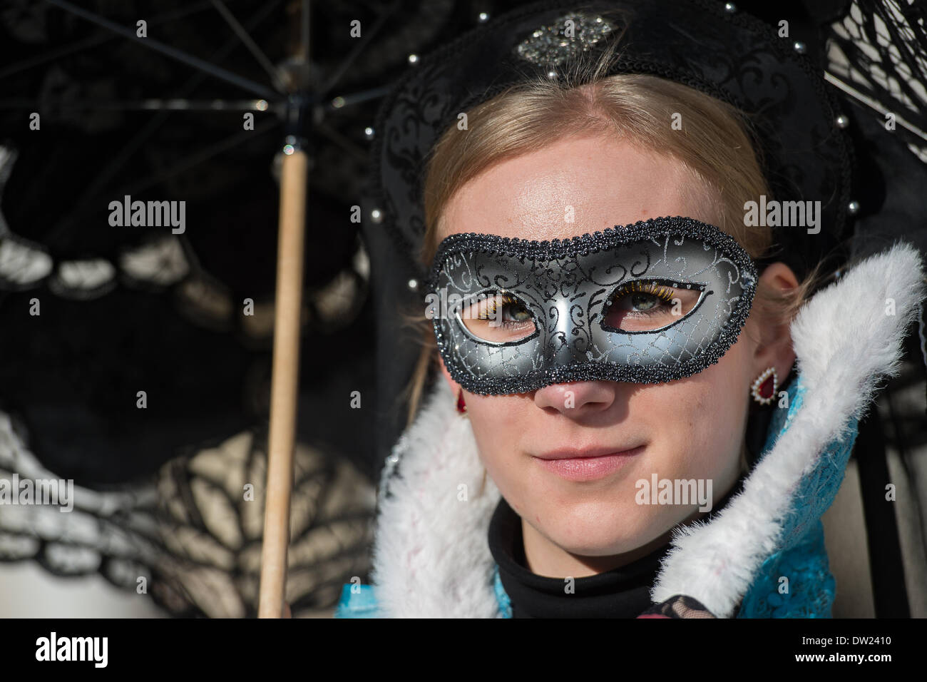 Venice, Italy. 25th Feb, 2014. A masked Carnivale attendee poses in the ...