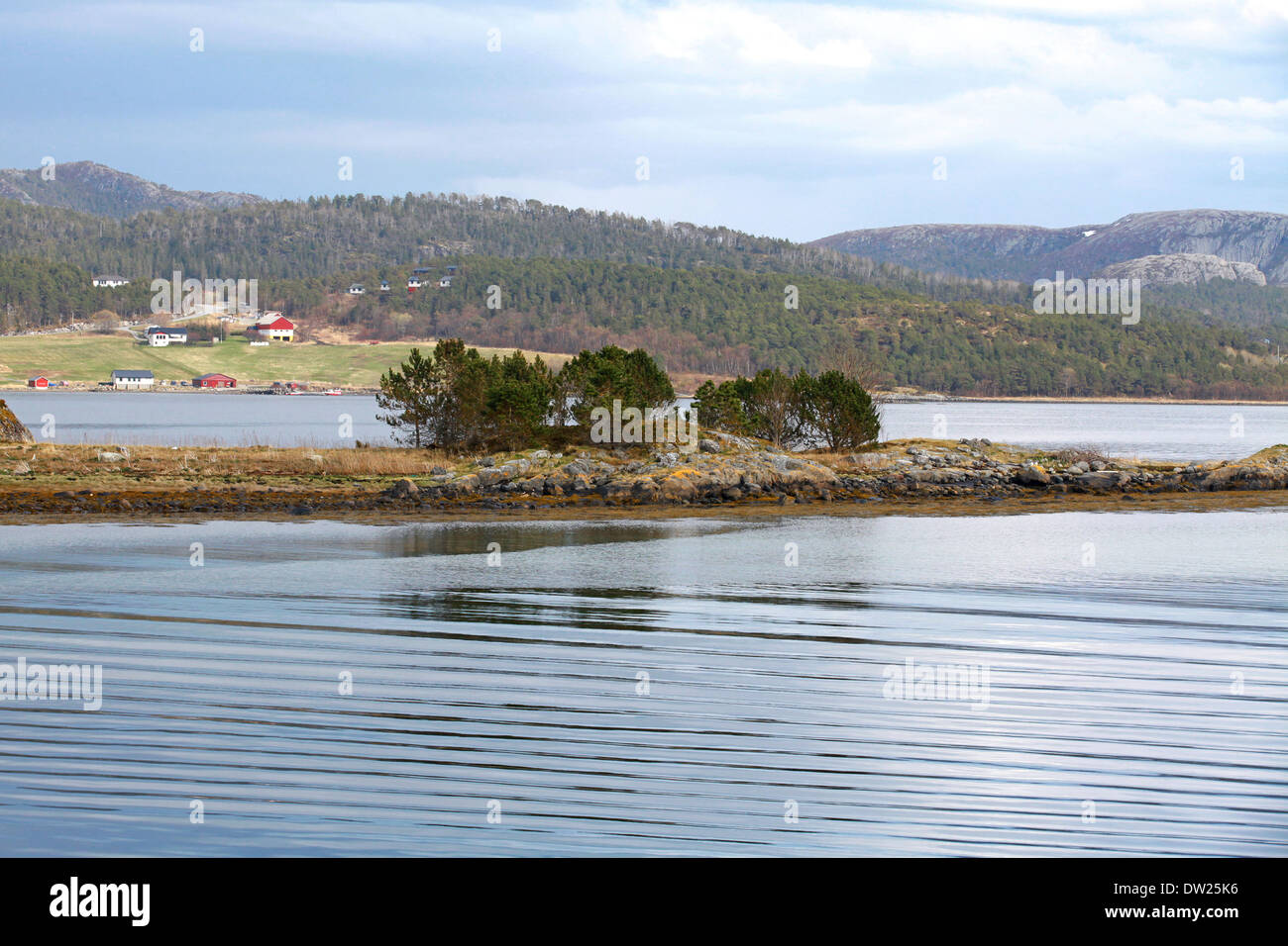 Coastal Norwegian landscape with trees on coast split Stock Photo - Alamy