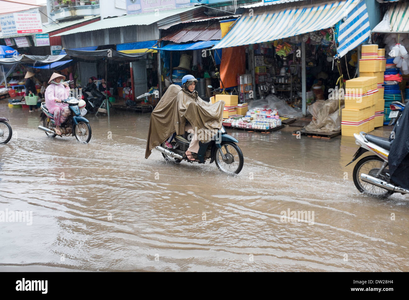 Motorcycle in the rain in Duong Dong on Phu Quoc Island Stock Photo - Alamy