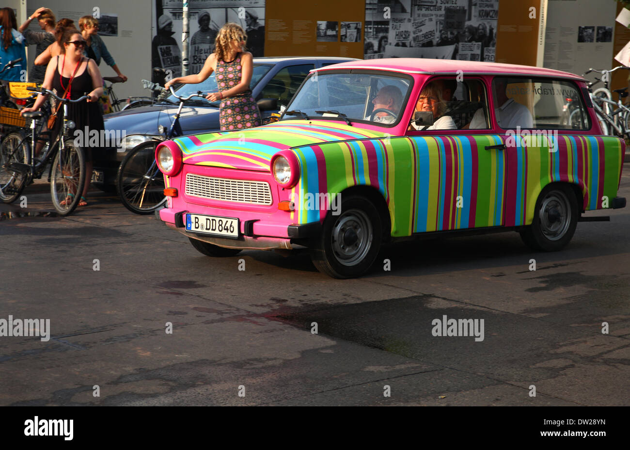 Tourists drive in an East German Trabant car at Checkpoint Charlie in ...