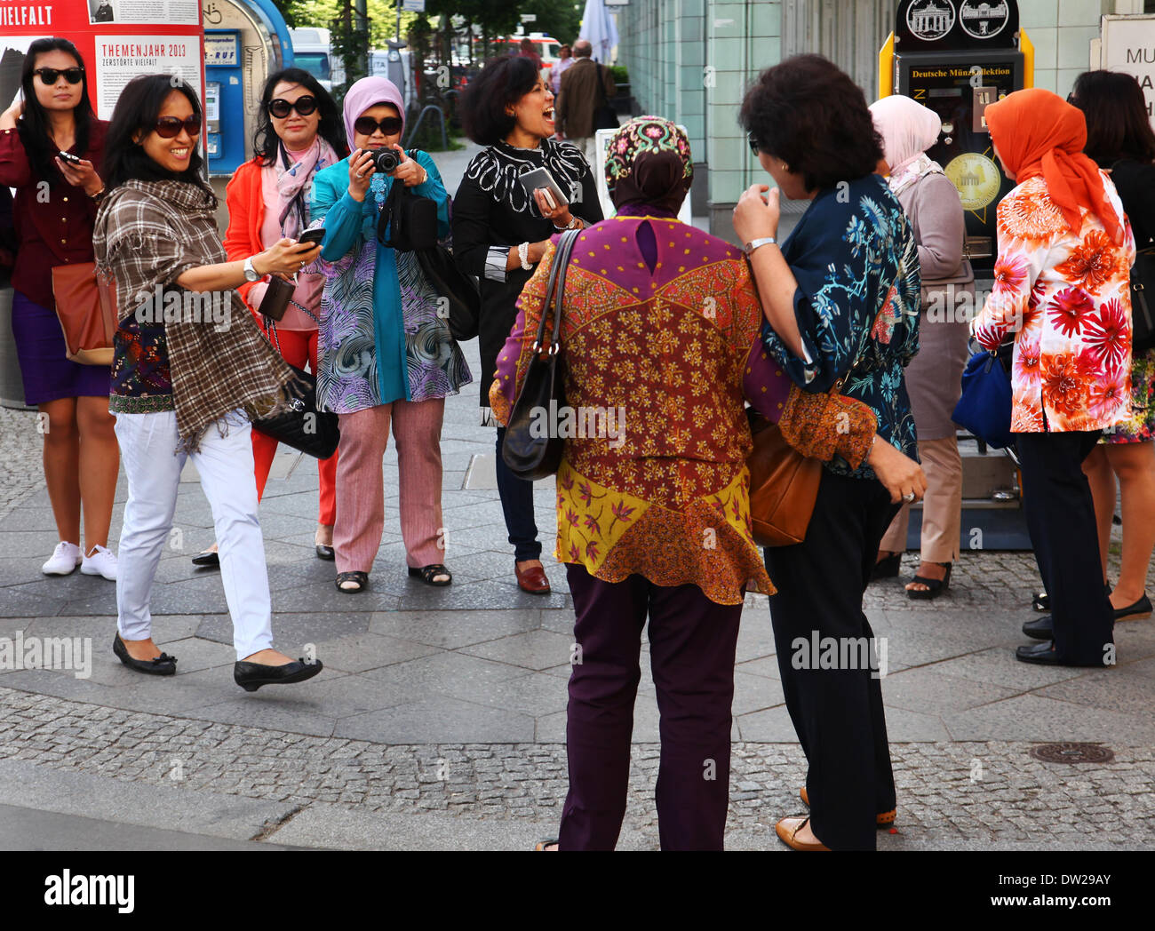 A group of female muslim tourists at Checkpoint Charlie in Berlin, June ...