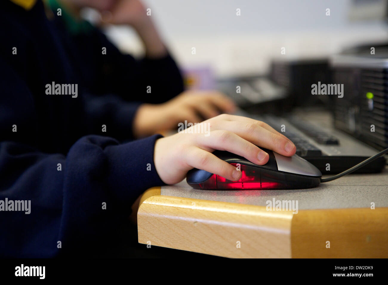 UK schoolboy at school in an ICT class using a mouse Stock Photo - Alamy