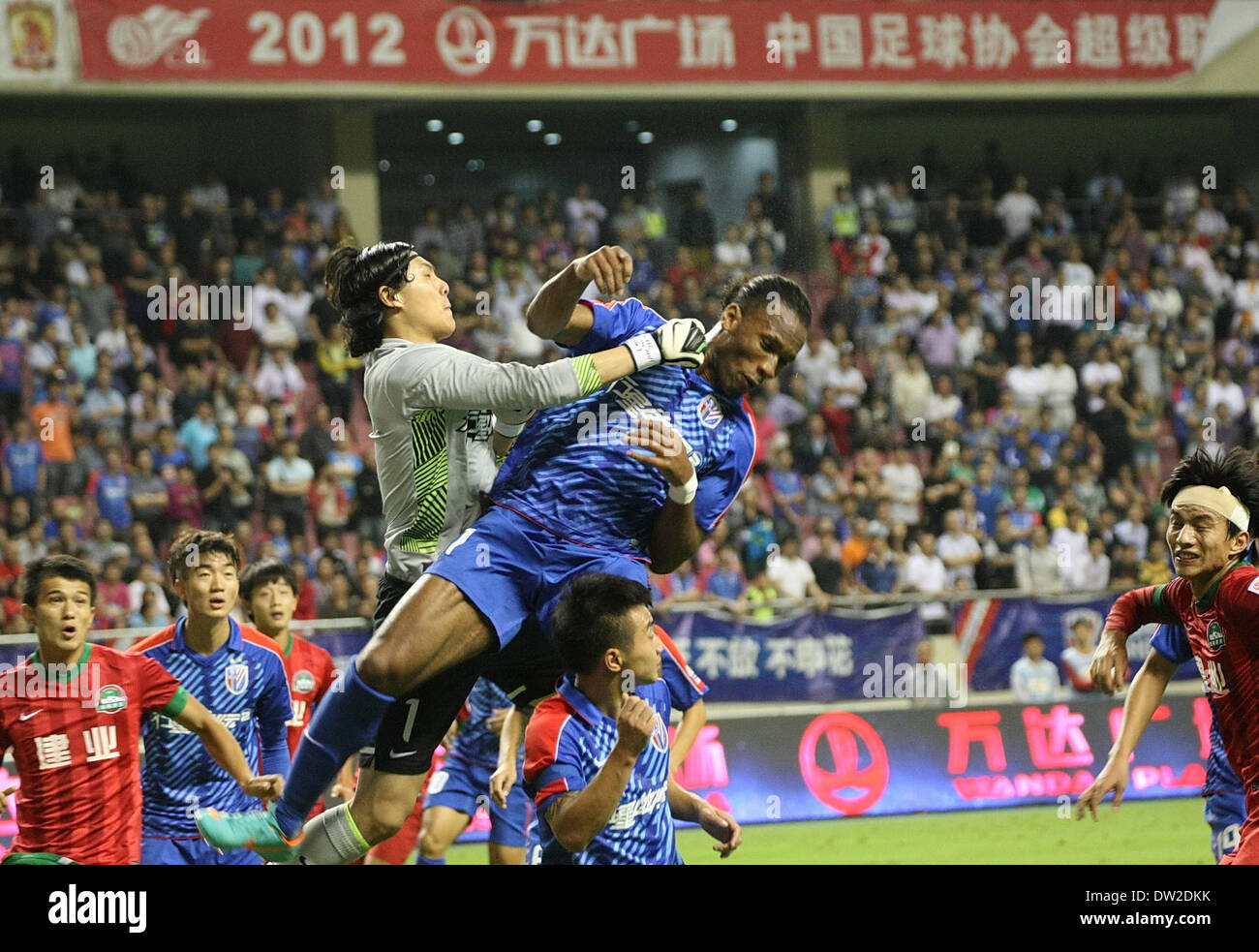 Didier Drogba Didier Drogba of Shanghai Shenhua collides with ... Didier Drogba Didier Drogba of Shanghai Shenhua collides with ...