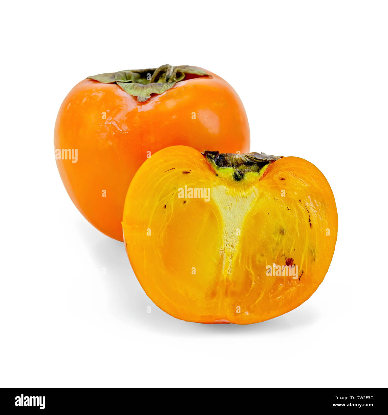 Whole and halves of persimmon isolated on white background Stock Photo ...