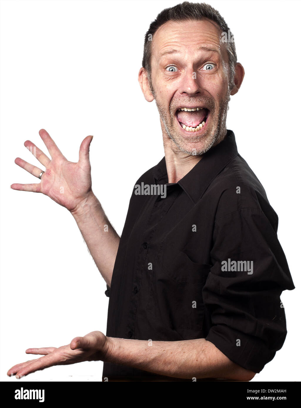 blue eyed middle aged man in black shirt presents something with a big ...