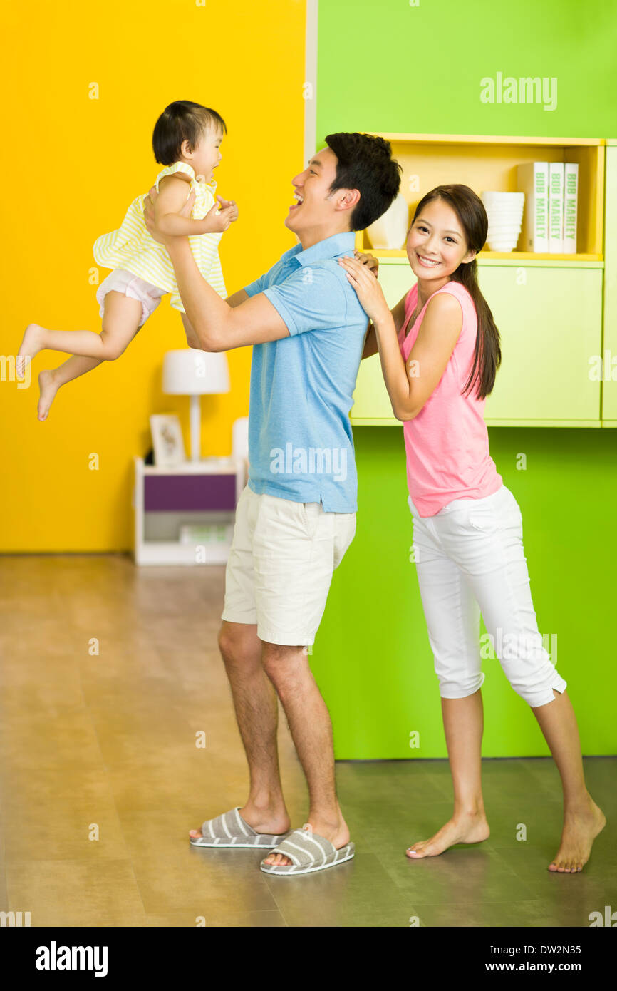 Excited father lifting little daughter up Stock Photo - Alamy