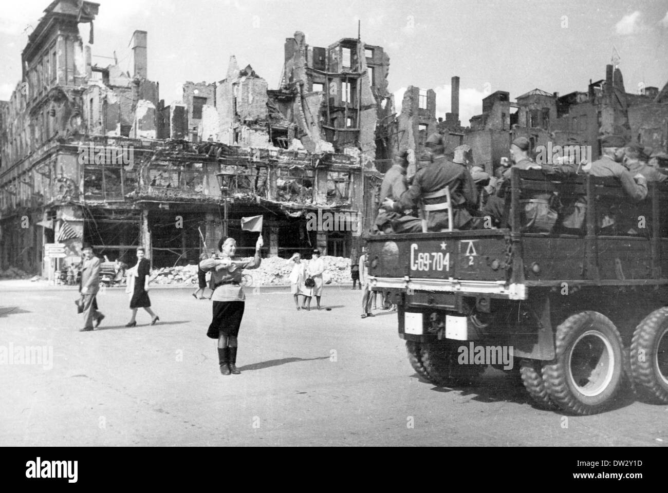 A female Soviet traffic cop of the Red Army regulates the flow of ...