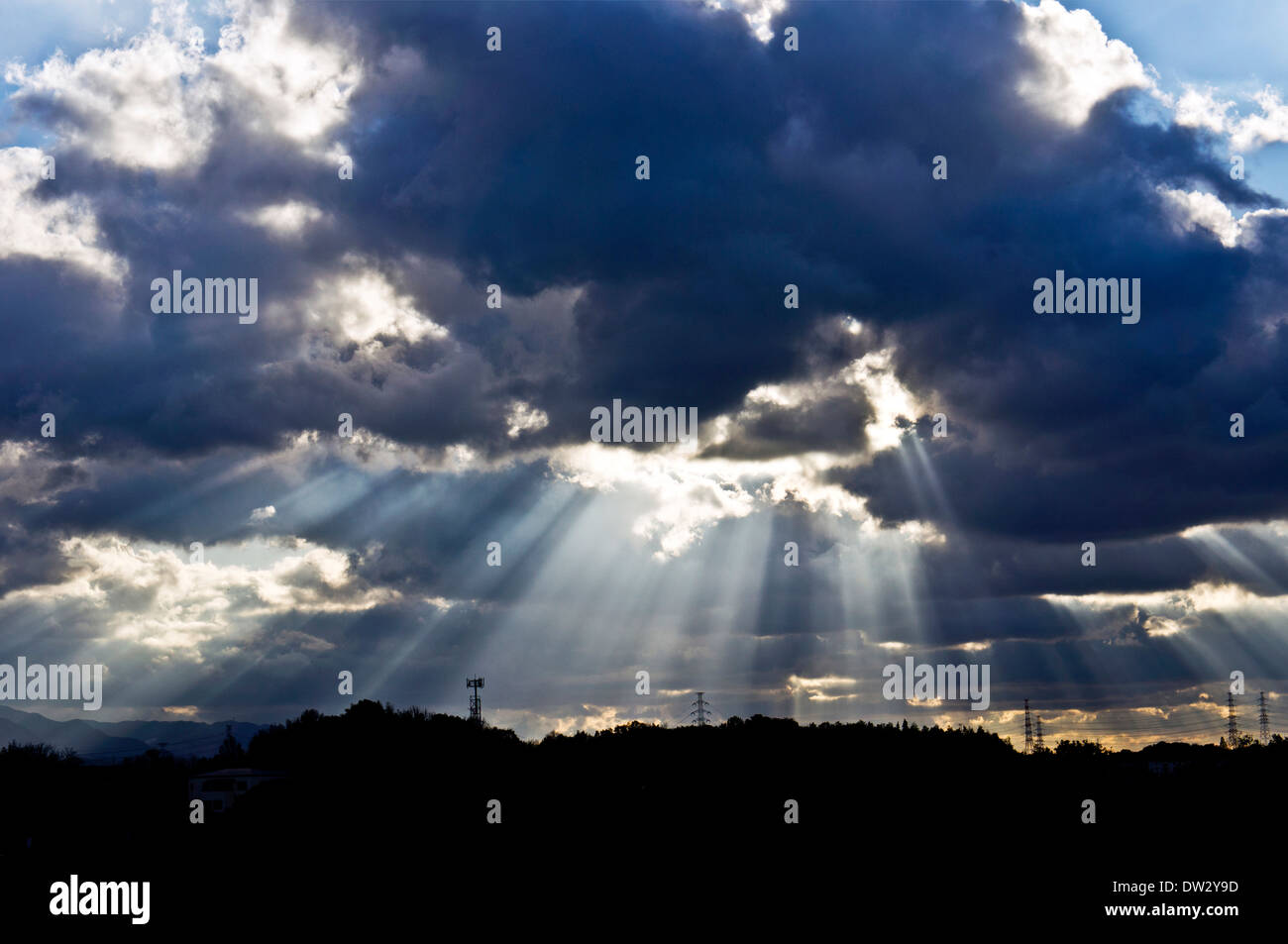 Shaft of light shining through clouds Stock Photo - Alamy