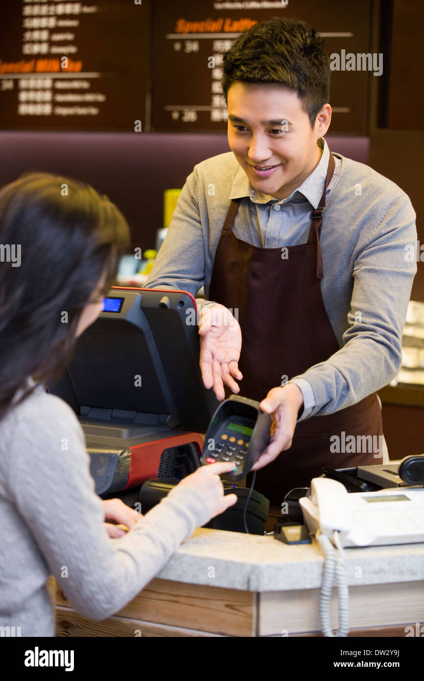 Customer entering credit card password Stock Photo - Alamy