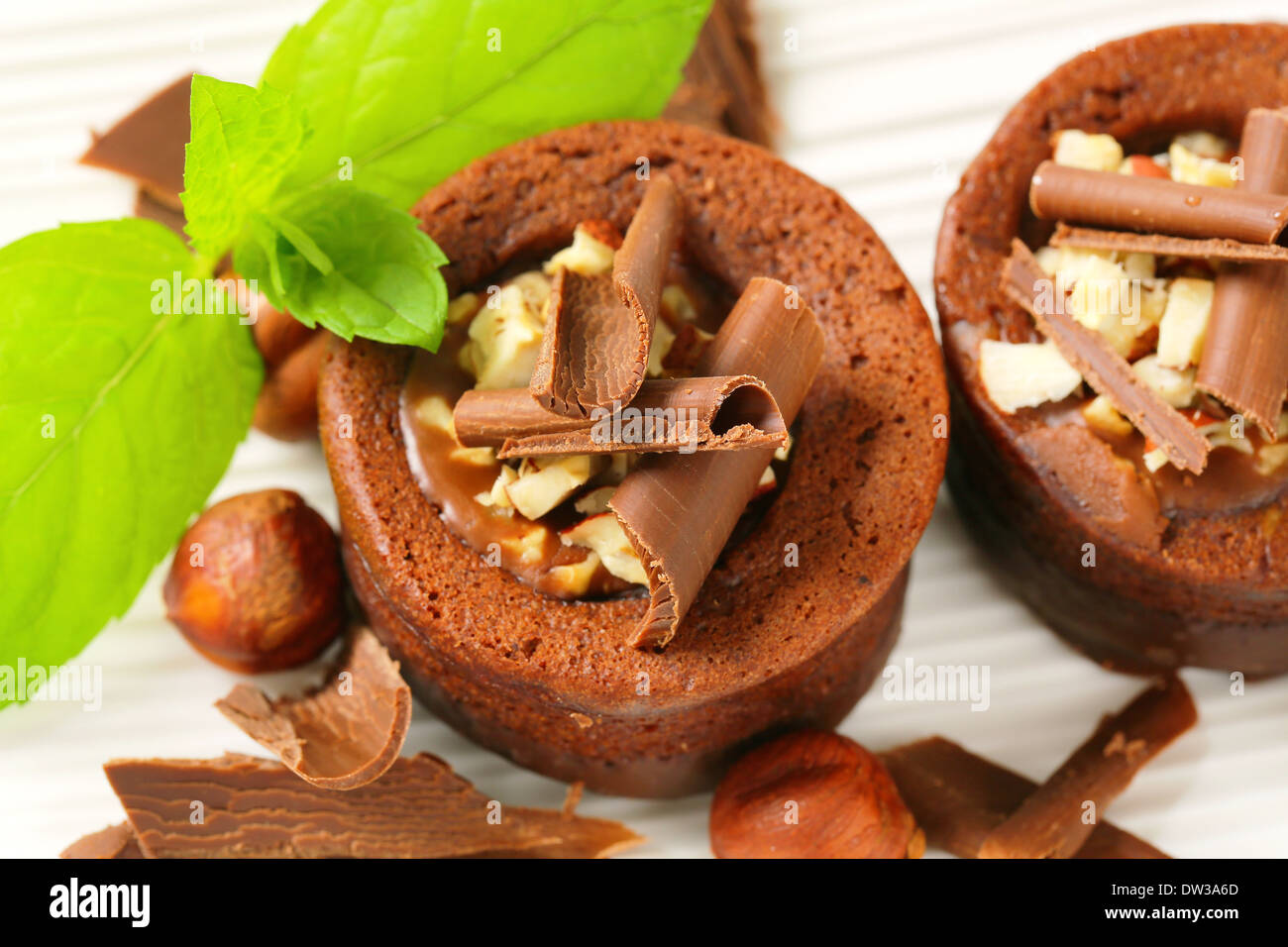 Mini chocolate cakes with hazelnut filling Stock Photo - Alamy
