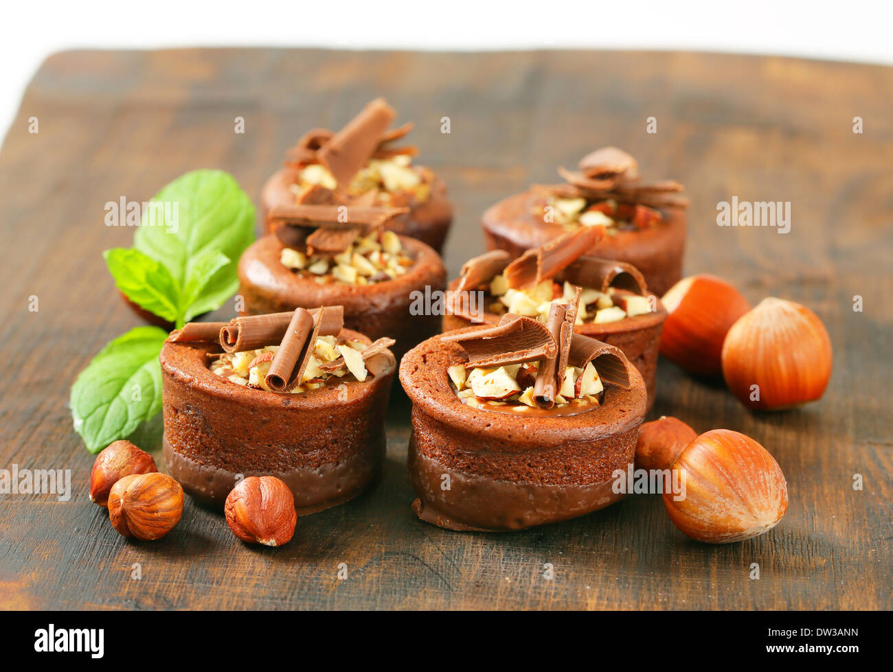 Mini chocolate cakes with hazelnut filling Stock Photo - Alamy