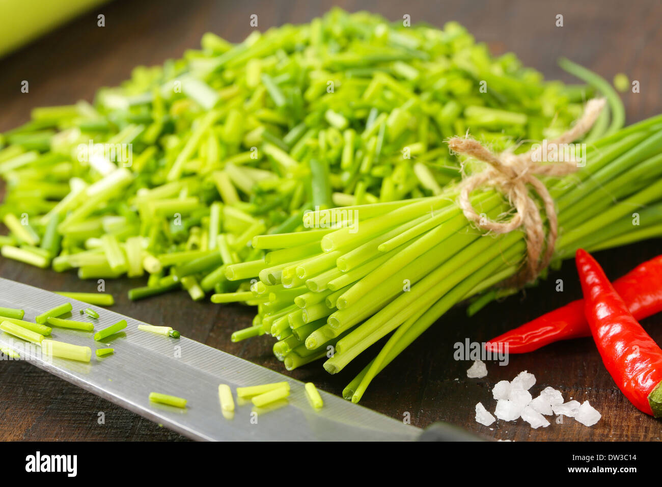 Fresh chives on chopping board Stock Photo - Alamy