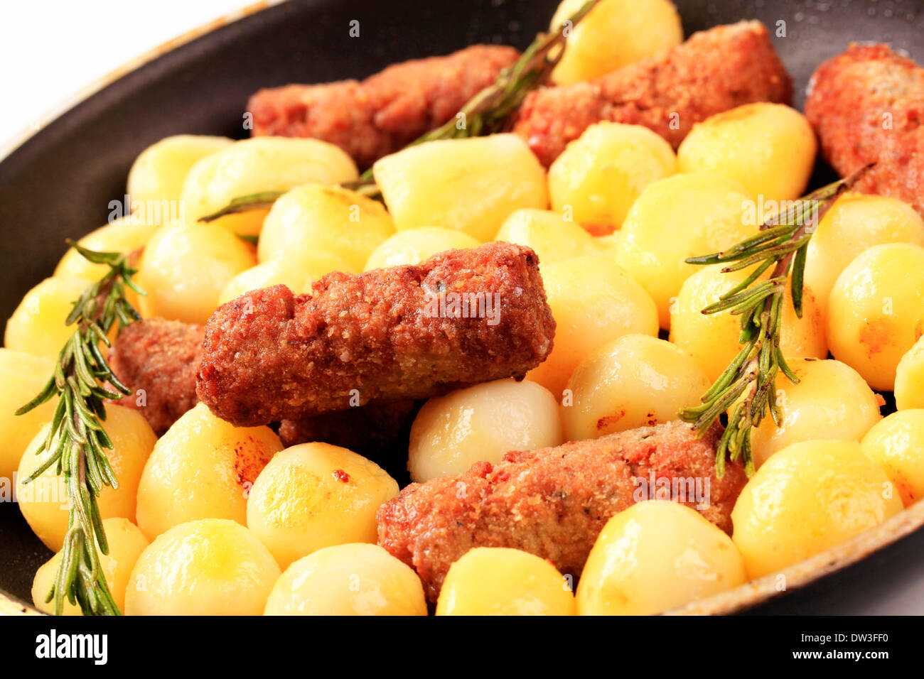 Pan-roasted minced meat kebabs and potatoes Stock Photo - Alamy