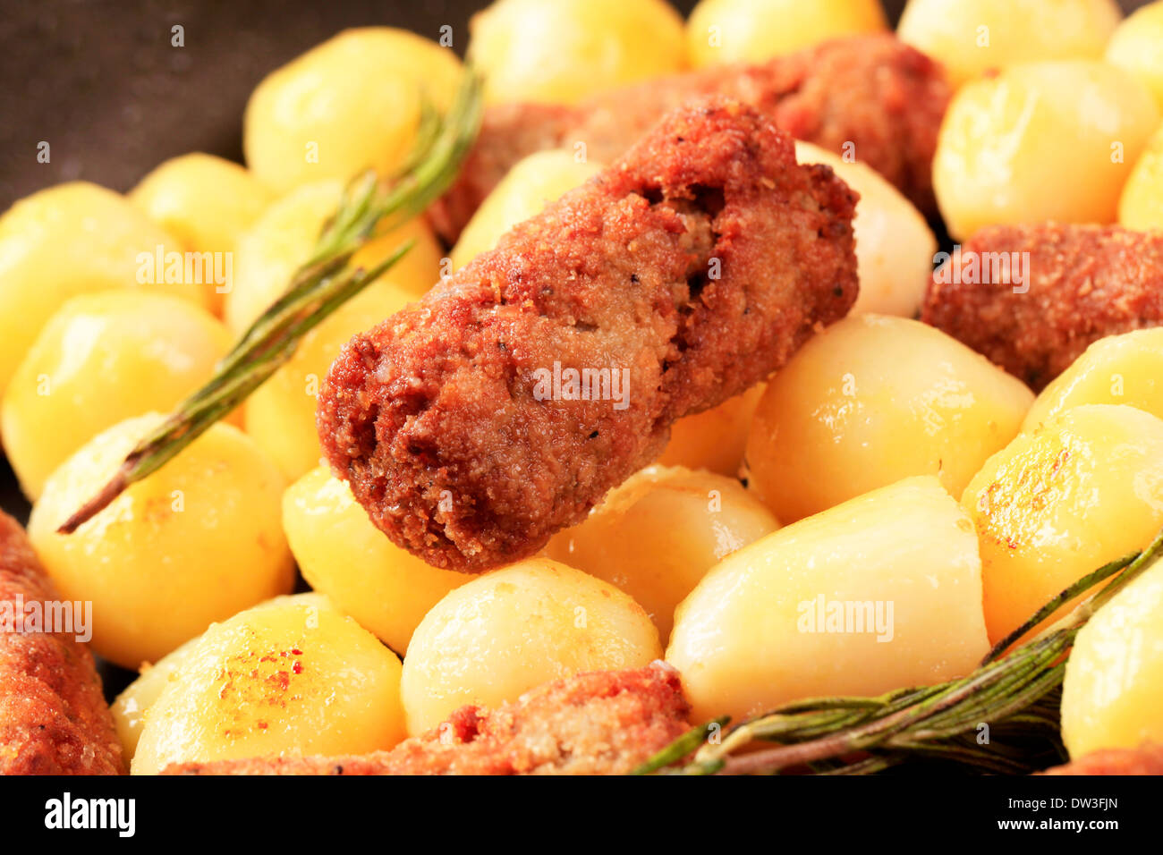 Pan-roasted minced meat kebabs and potatoes Stock Photo - Alamy
