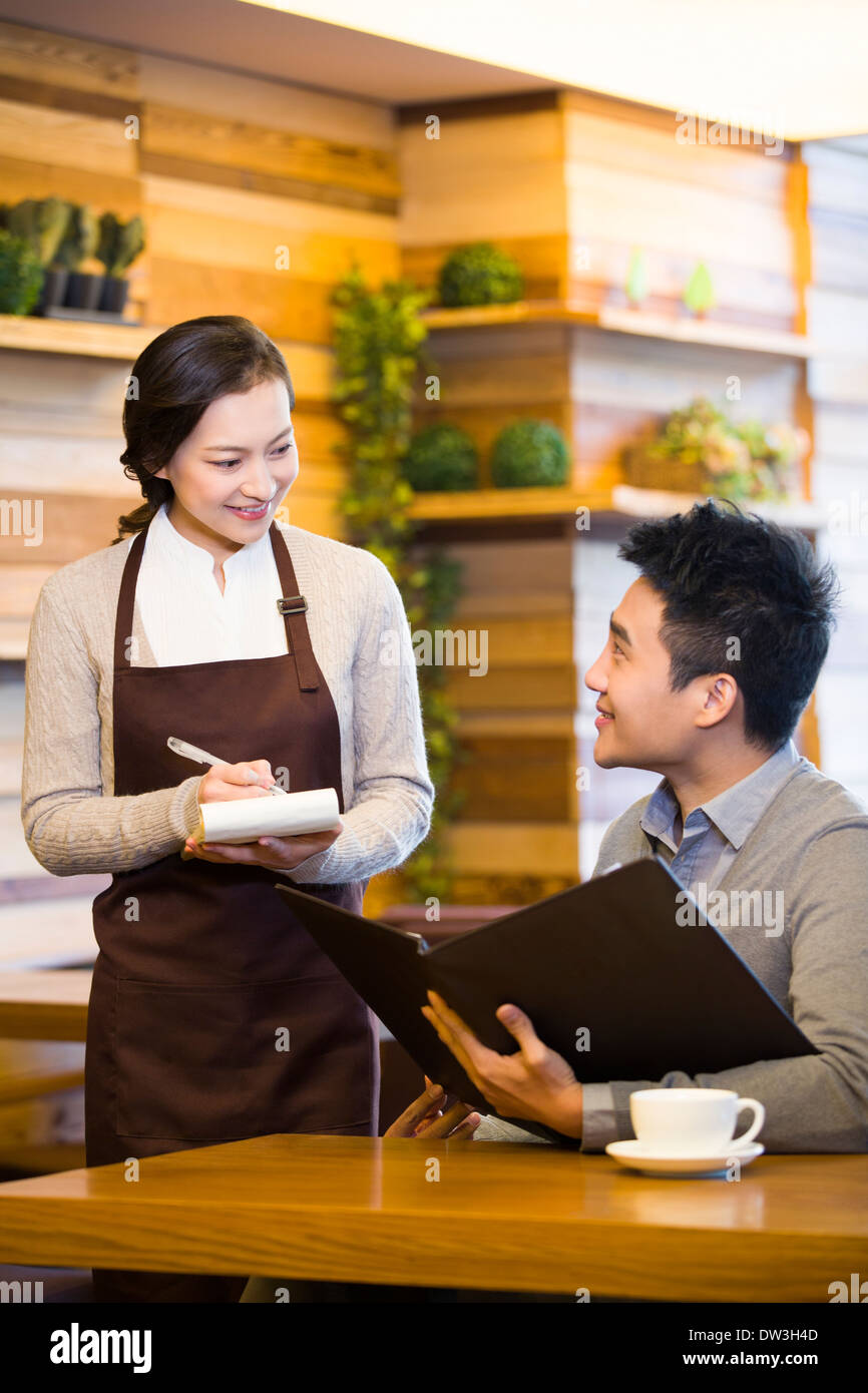 Young man ordering hi-res stock photography and images - Alamy