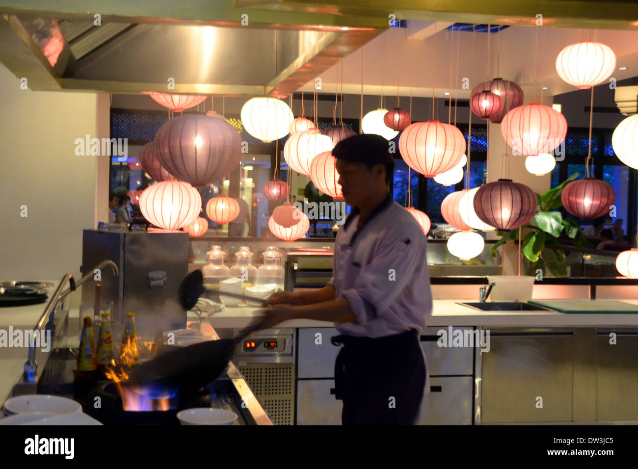 chef cooking over chinese wok Stock Photo - Alamy