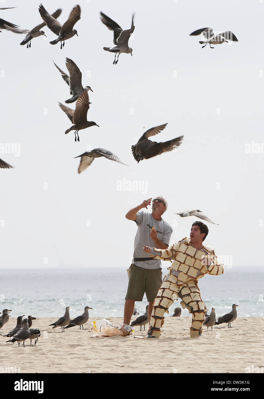 A man wears a suit made from bread in a bid to attract flocks of ...